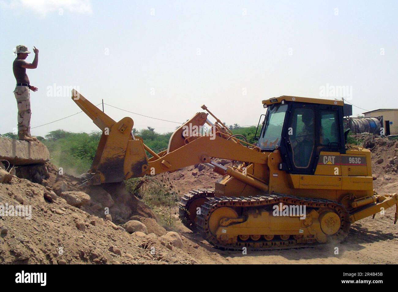 US Navy Equipment Operator 3rd Class assigned to Naval Mobile ...