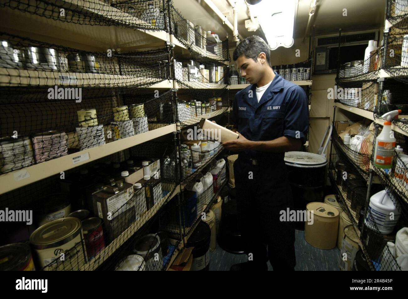 US Navy Electrician's Mate Fireman inventories, inspects, and updates ...