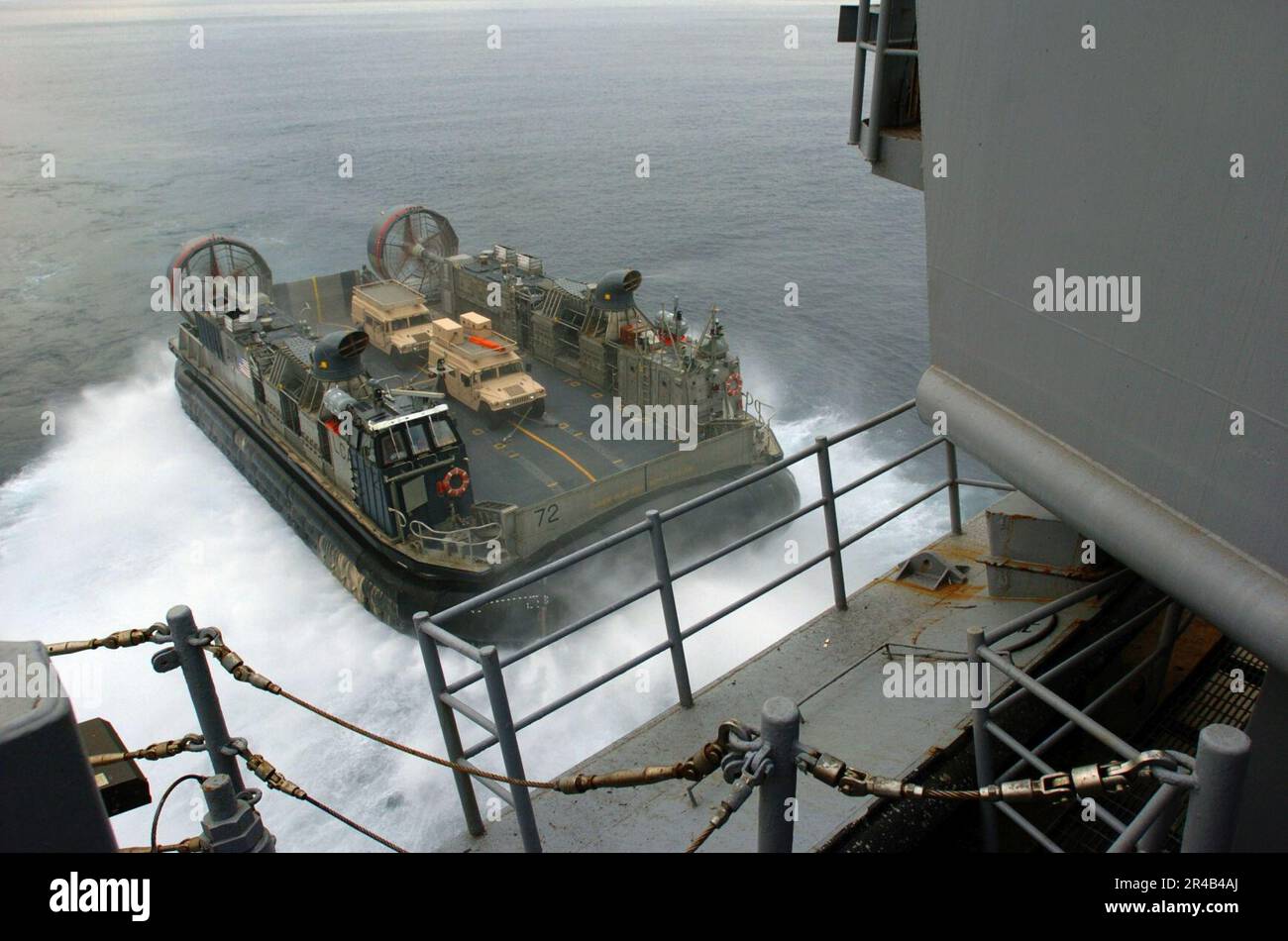 US Navy A Landing Craft, Air Cushion, assigned to Assault Craft Unit Five (ACU-5), backs out of ...