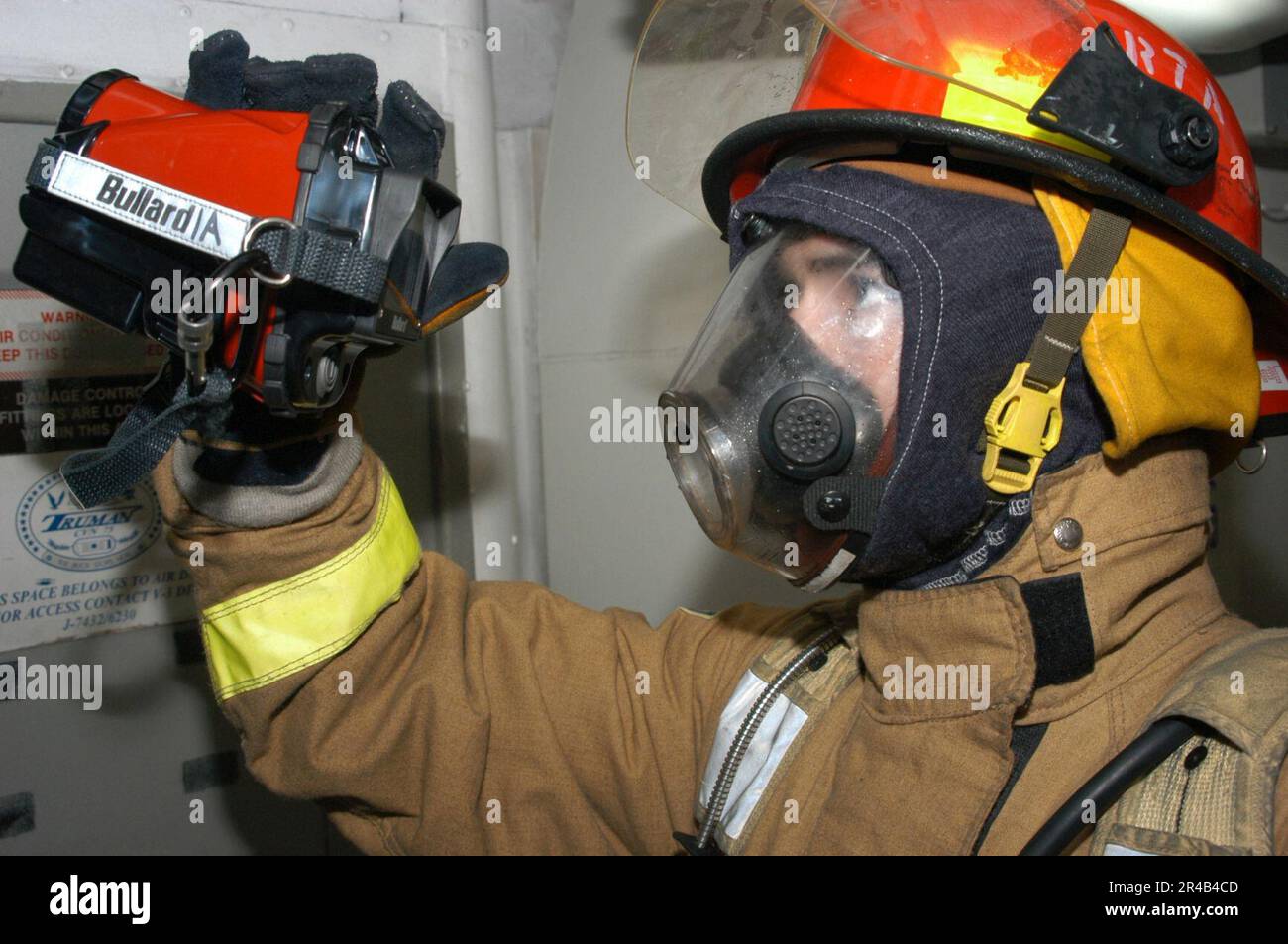 US Navy A Sailor assigned to Repair Locker Four, uses a Navy ...