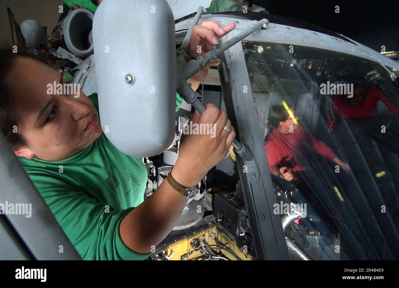 US Navy Aviation Machinist's Mate 2nd Class performs preventative ...