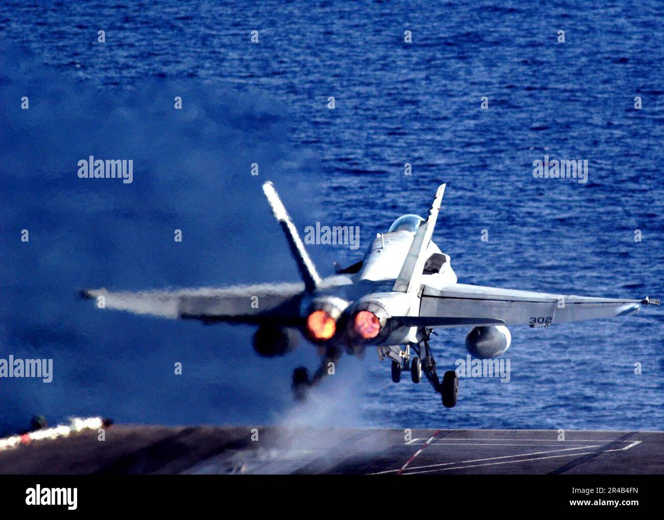 US Navy An F-A-18C Hornet launches from the bow of the Nimitz-class ...