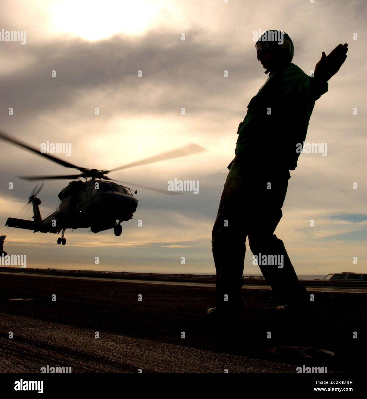 US Navy A Landing Signal Enlisted (LSE) checks to ensure a clear flight ...