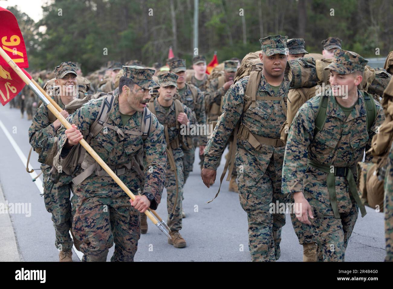 U.S. Marines and Sailors with 2d Marine Division race with guidons ...