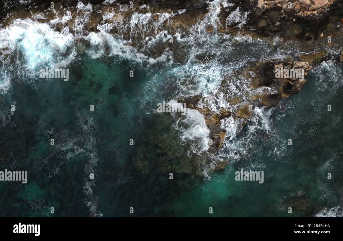 An aerial view of a stunning ocean landscape featuring rolling waves ...