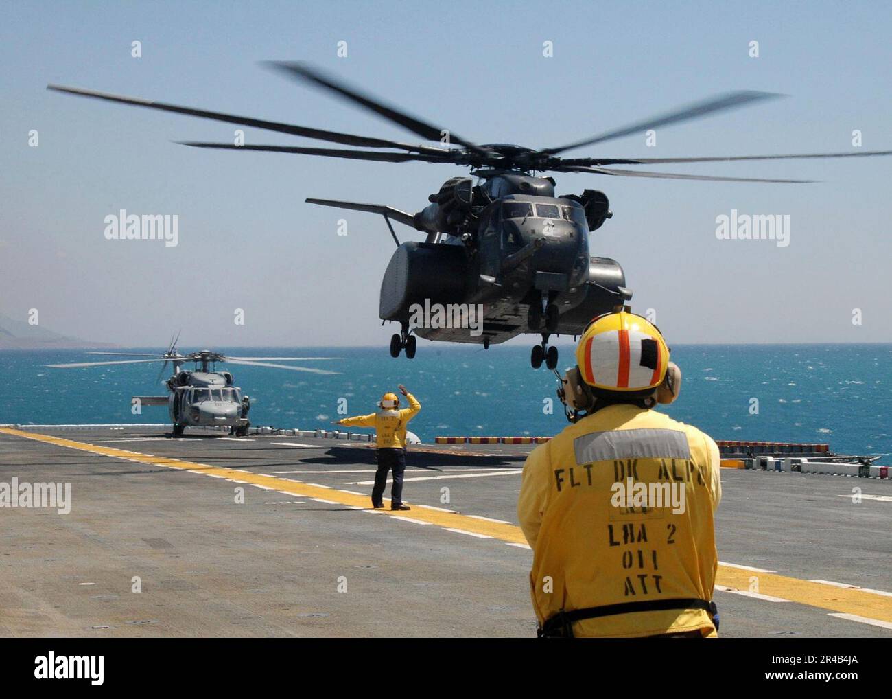 US Navy An MH-53E Sea Dragon helicopter lands on the flight deck aboard ...