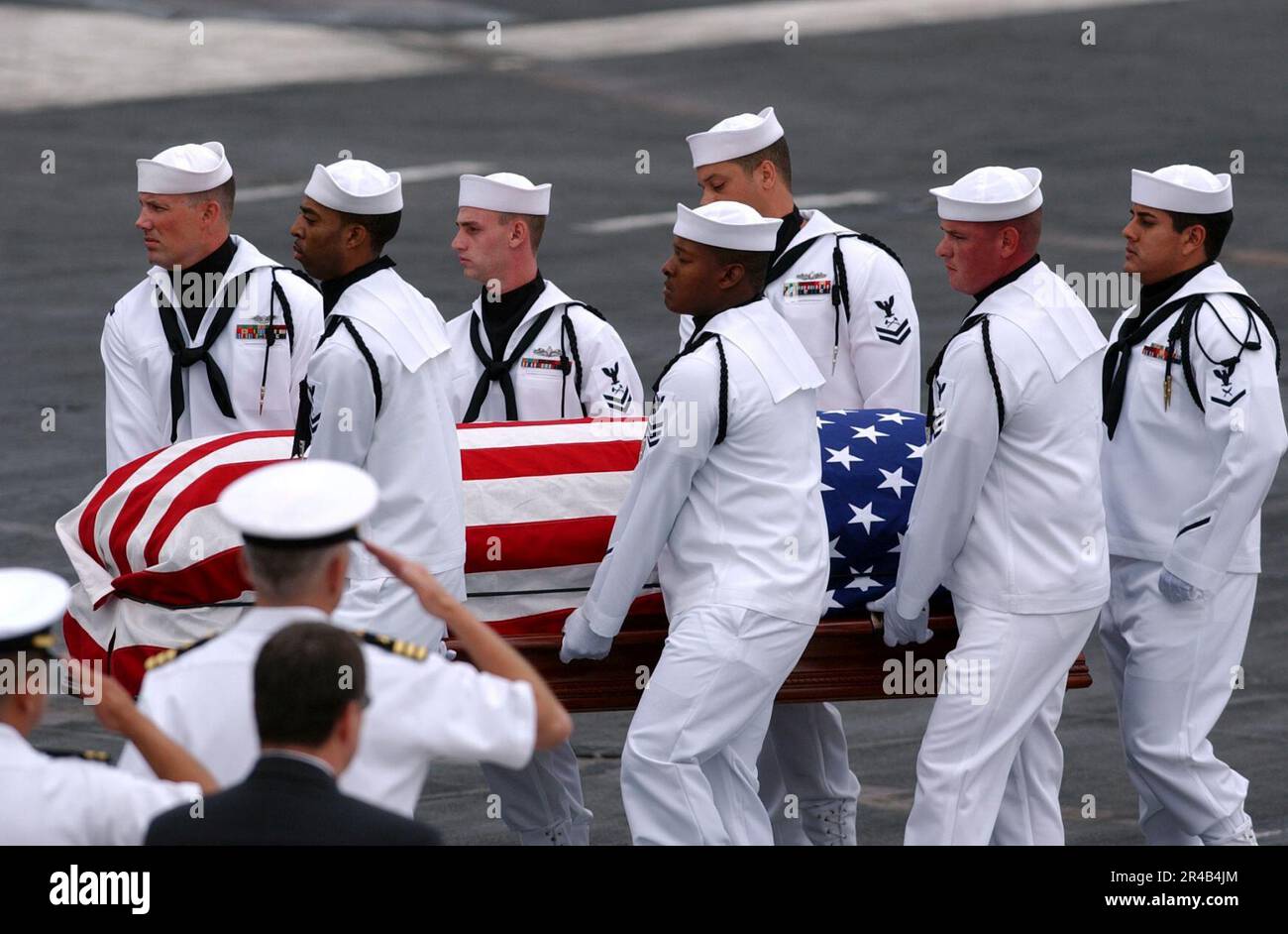 US Navy Pallbearers of the Ceremonial Honor Guard carry the casket of ...
