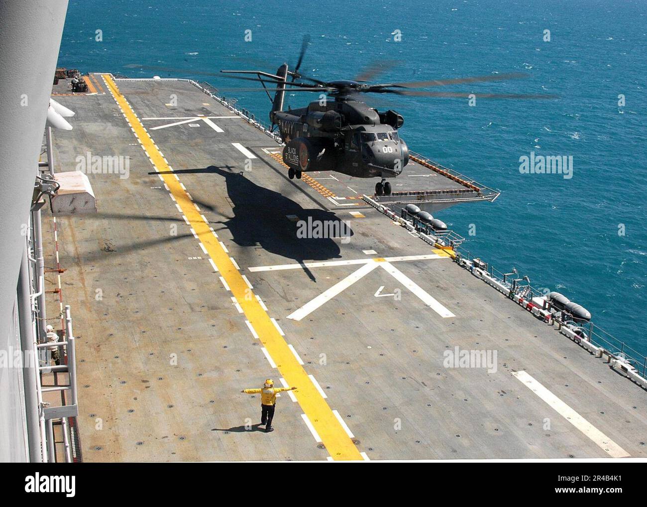 US Navy An MH-53E Sea Dragon helicopter lands on the flight deck aboard the amphibious assault ...