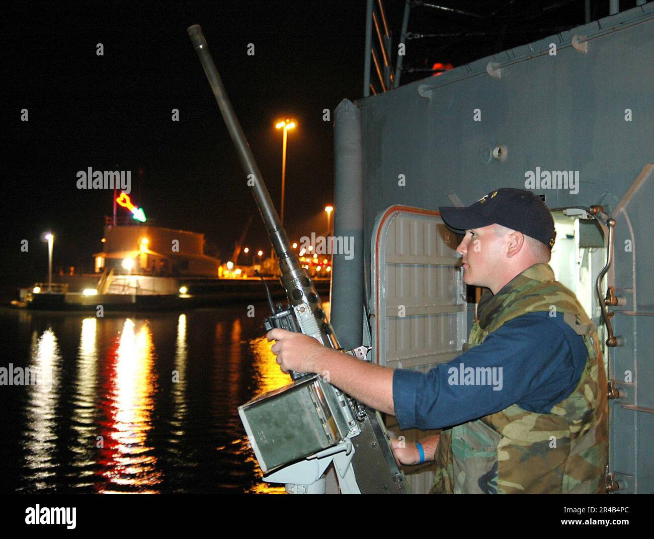 US Navy Gunner's Mate Seaman Apprentice mans a .50 caliber during a ...