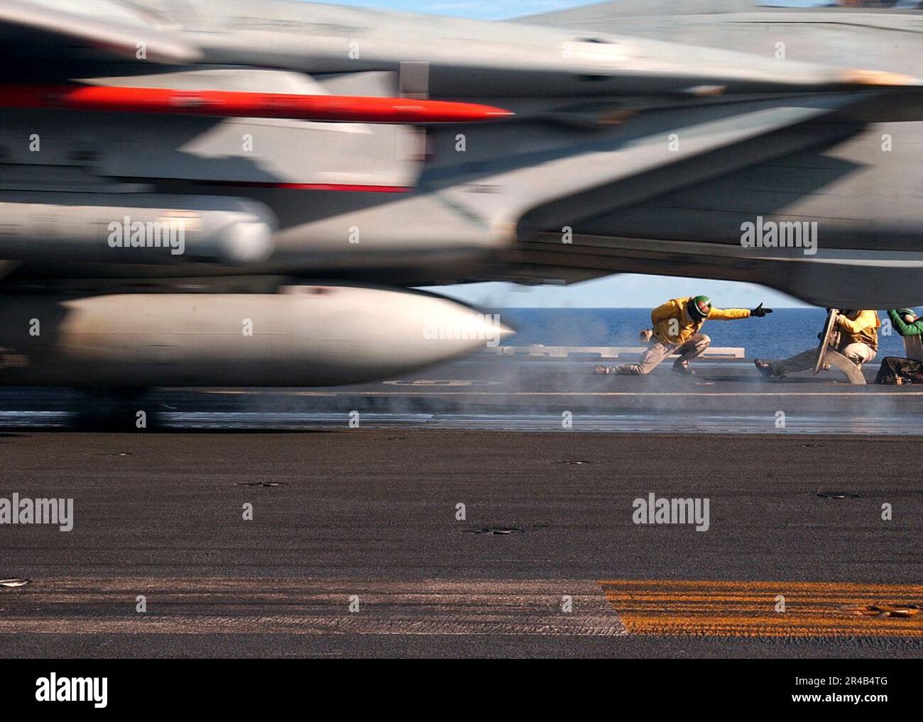 US Navy A catapult shooter aboard the Nimitz-class aircraft carrier USS ...