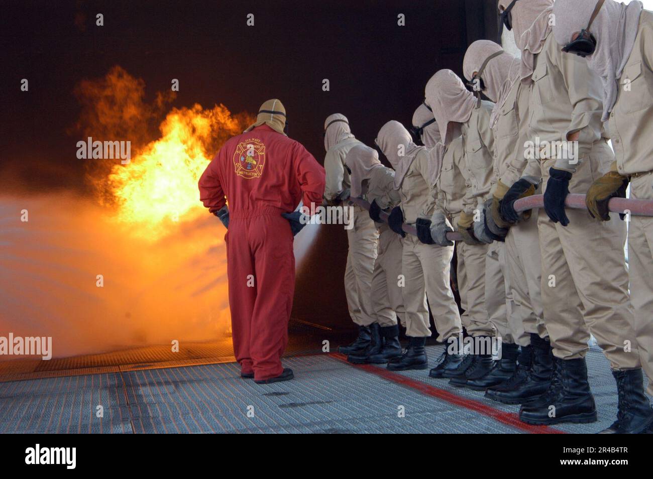US Navy Aviation Boatswain's Mate 2nd Class instructs U.S. Navy ...