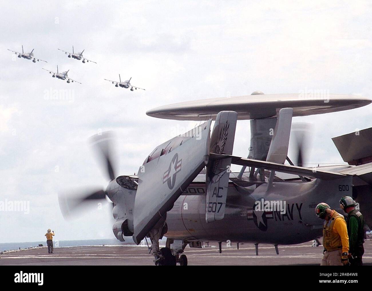 US Navy Four F-A-18C Hornets perform a diamond formation fly-by over ...