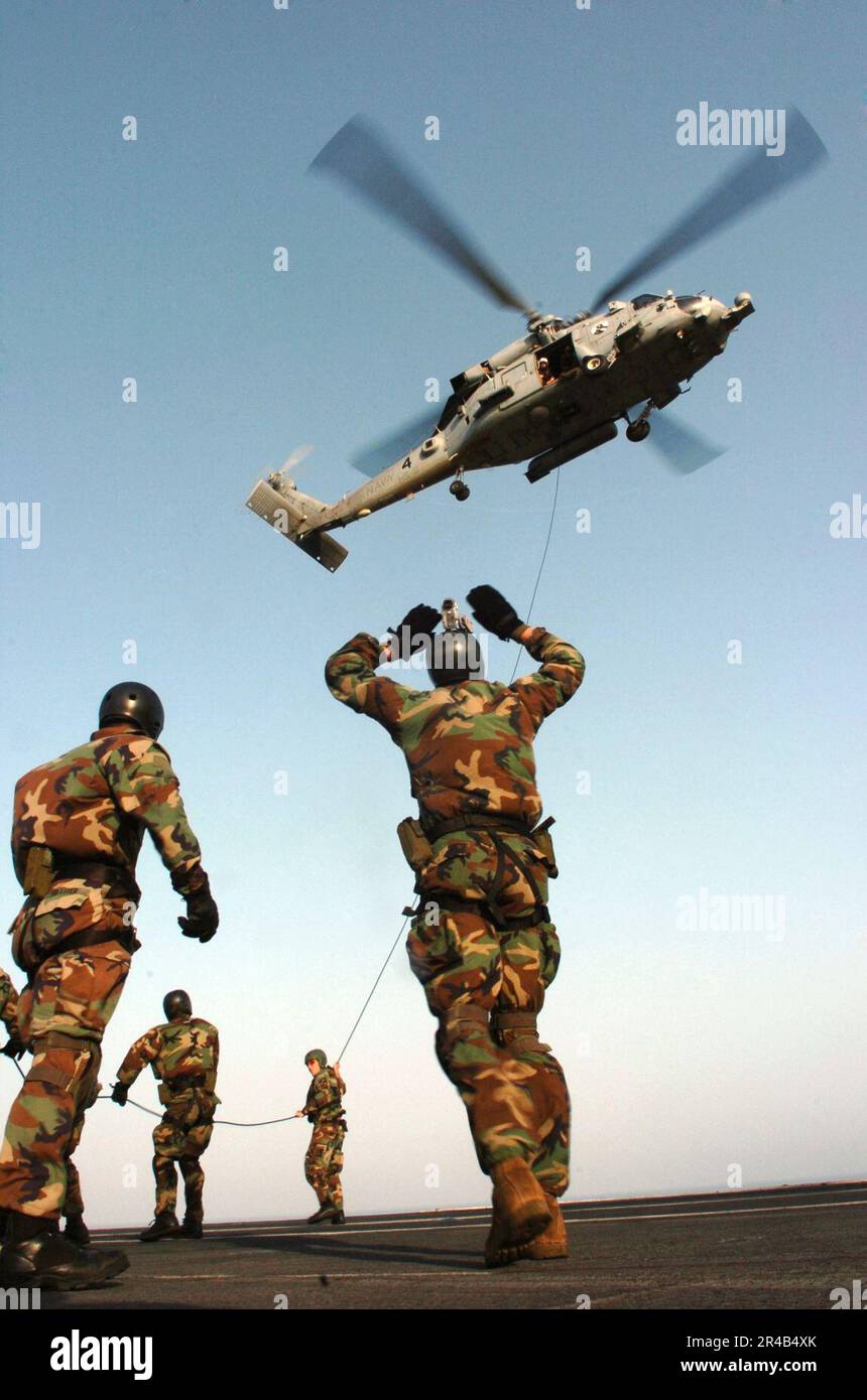 US Navy Members of Explosive Ordnance Disposal Mobile Unit One One ...