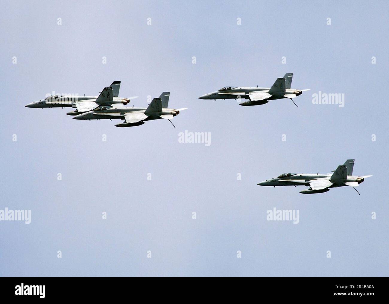 US Navy Four F-A-18C Hornets perform a diamond formation fly-by over ...