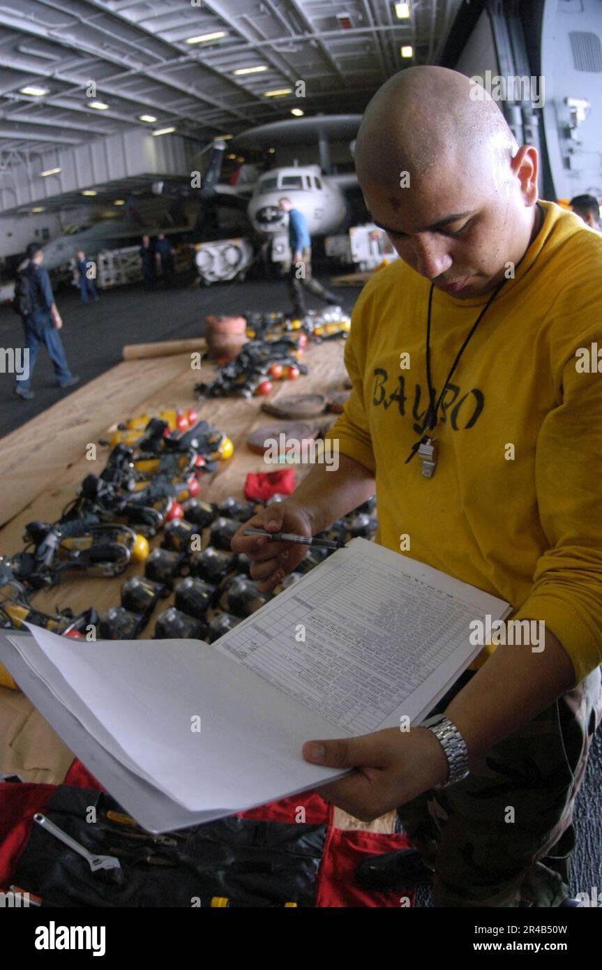 US Navy Aviation Boatswain's Mate 2nd Class performs an inventory of ...