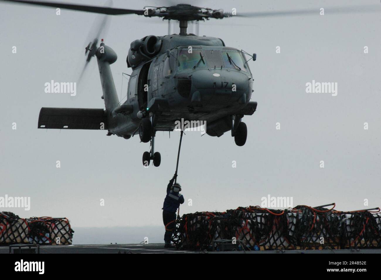 US Navy A Sailor assigned to the Military Sealift Command (MSC) fast ...
