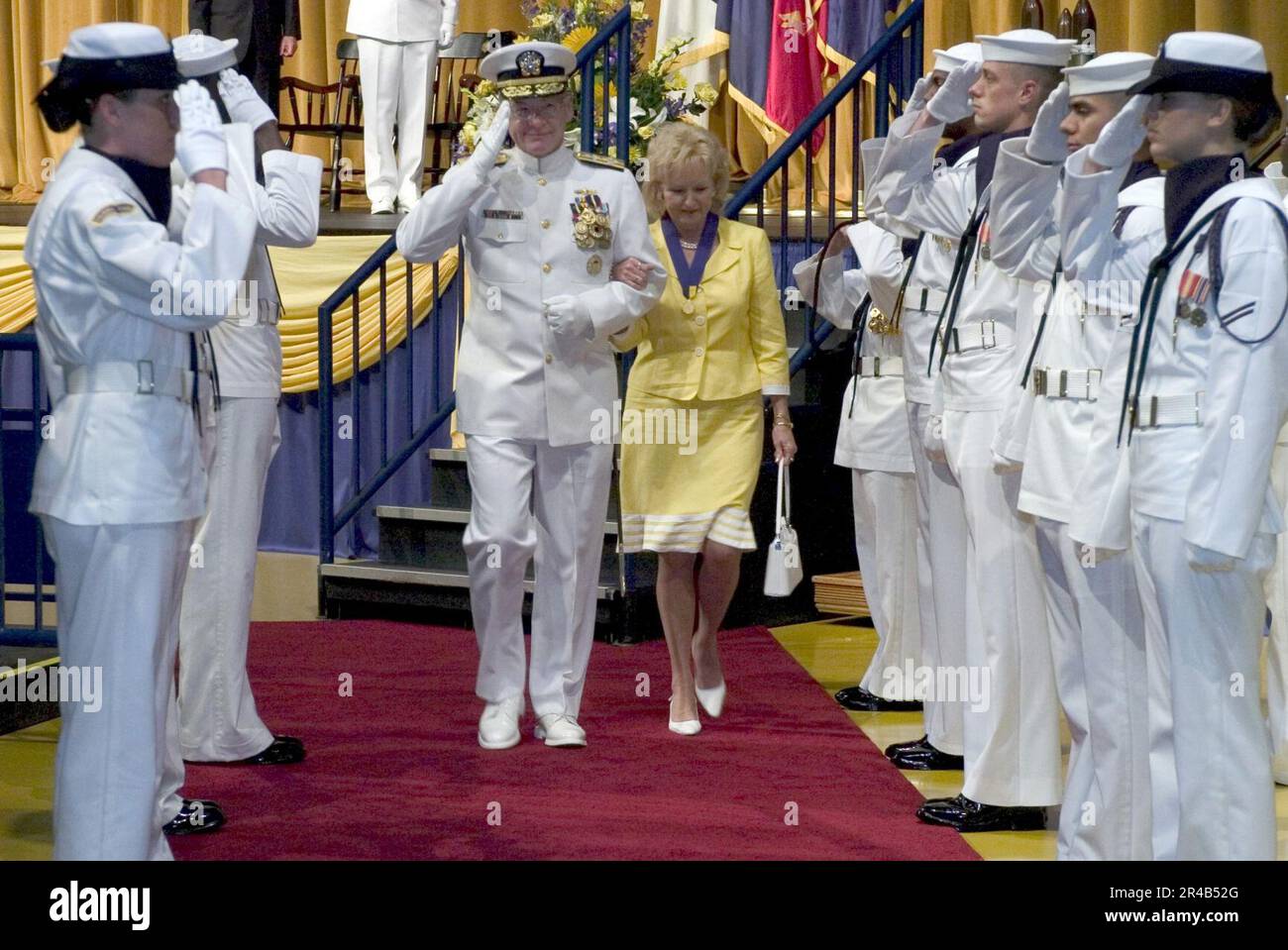US Navy Retired Adm. Vern Clark and his wife Connie walk through honor ...