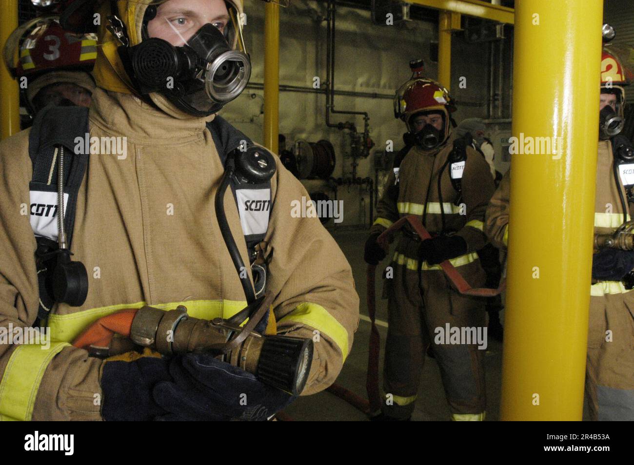 US Navy U.S. Coast Guard Boatswain's Mate 1st Class stands by to enter ...