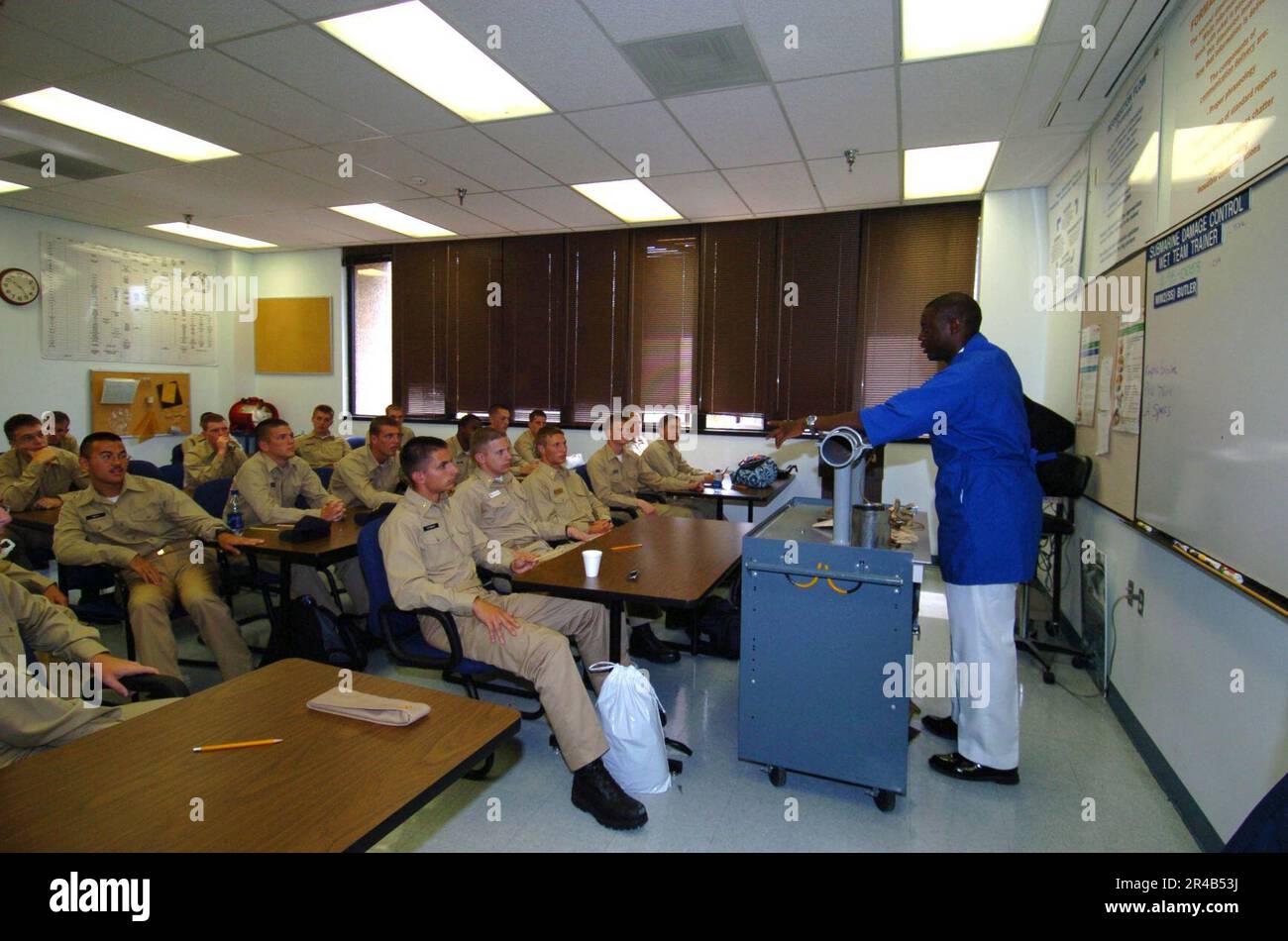US Navy Machinist's Mate 2nd Class instructs U.S. Naval Reserve Officer ...