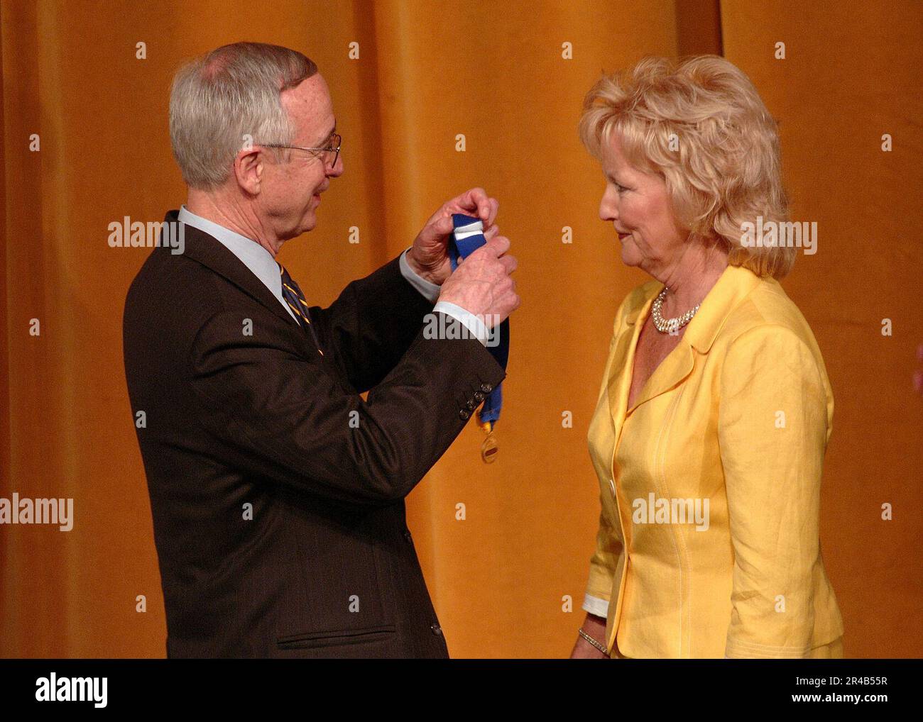 US Navy Secretary of the Navy Gordon England presents Mrs. Connie Clark ...
