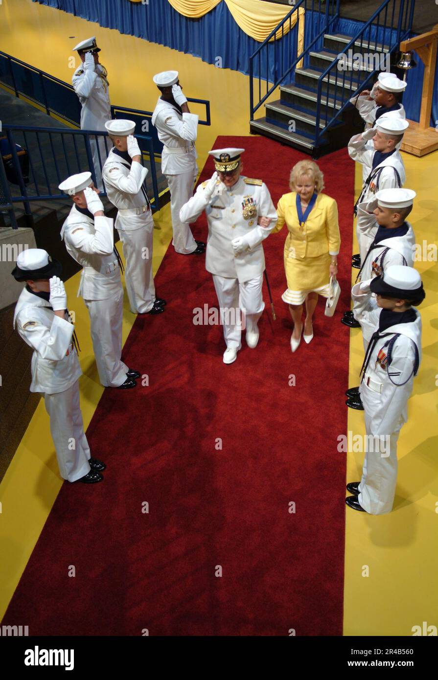 US Navy Retired Adm. Vern Clark and his wife Connie walk through honor ...
