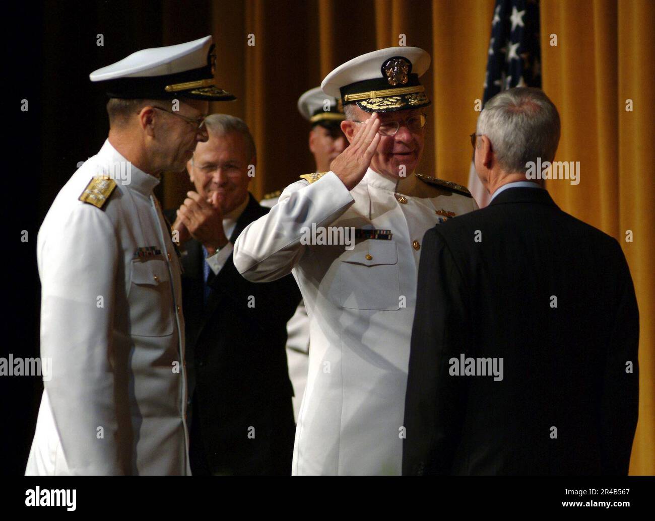 US Navy Adm. Vern Clark salutes Secretary of the Navy Gordon England ...