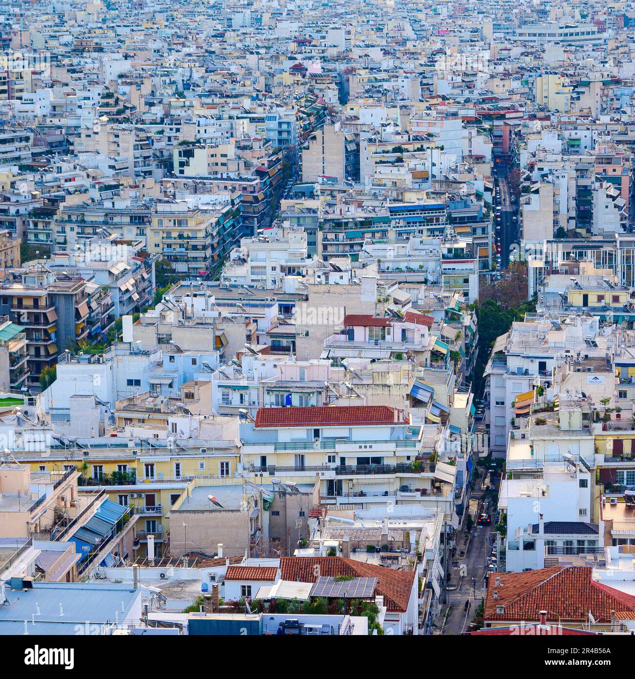 This aerial photograph captures a sprawling cityscape from a high ...