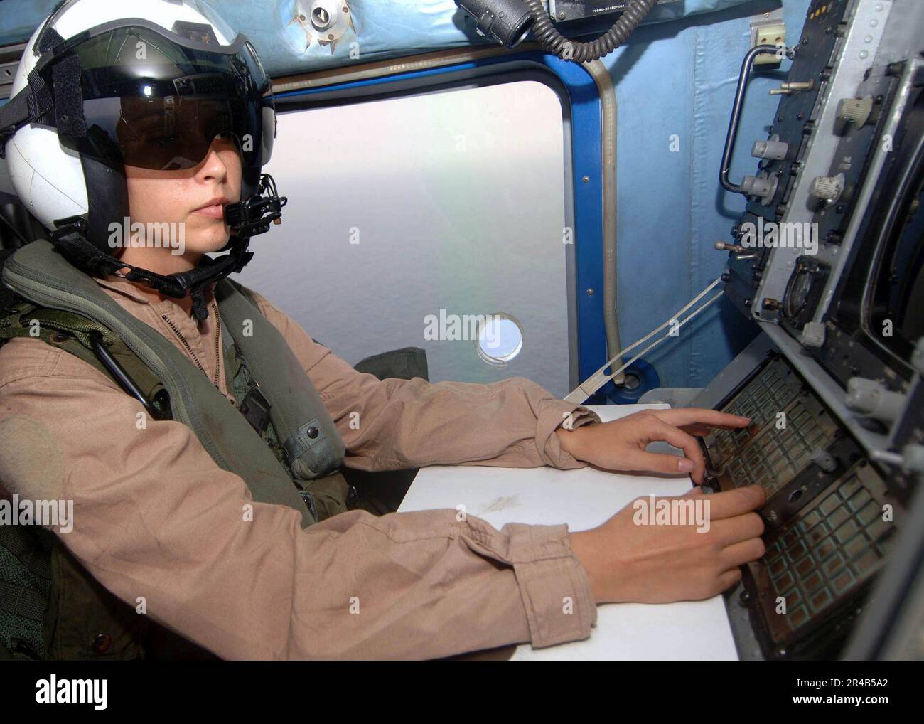 US Navy Aviation Warfare Systems Operator 2nd class monitors surface ...