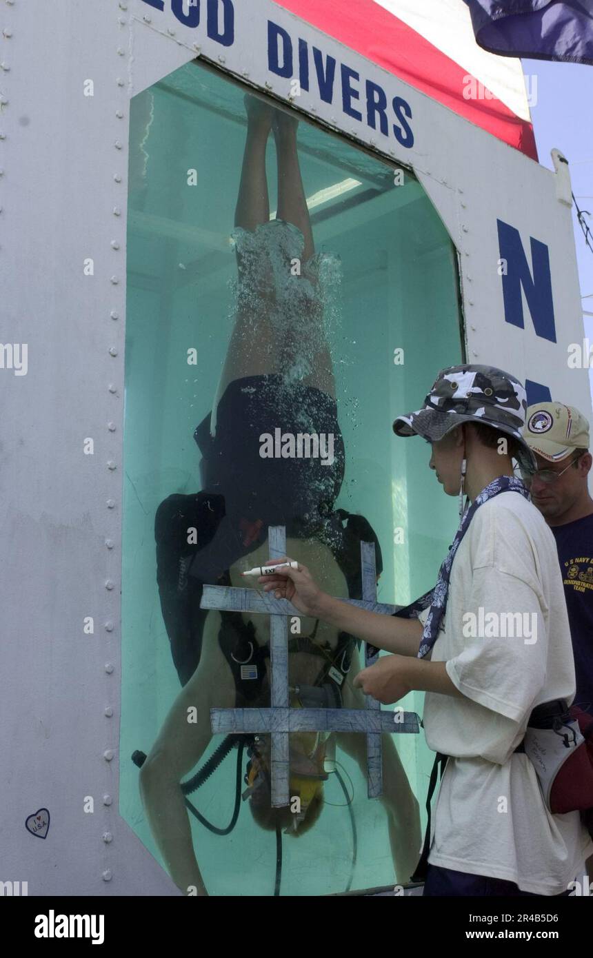 US Navy A Boy Scout plays tick-tack-toe with a U.S. Navy diver at an ...
