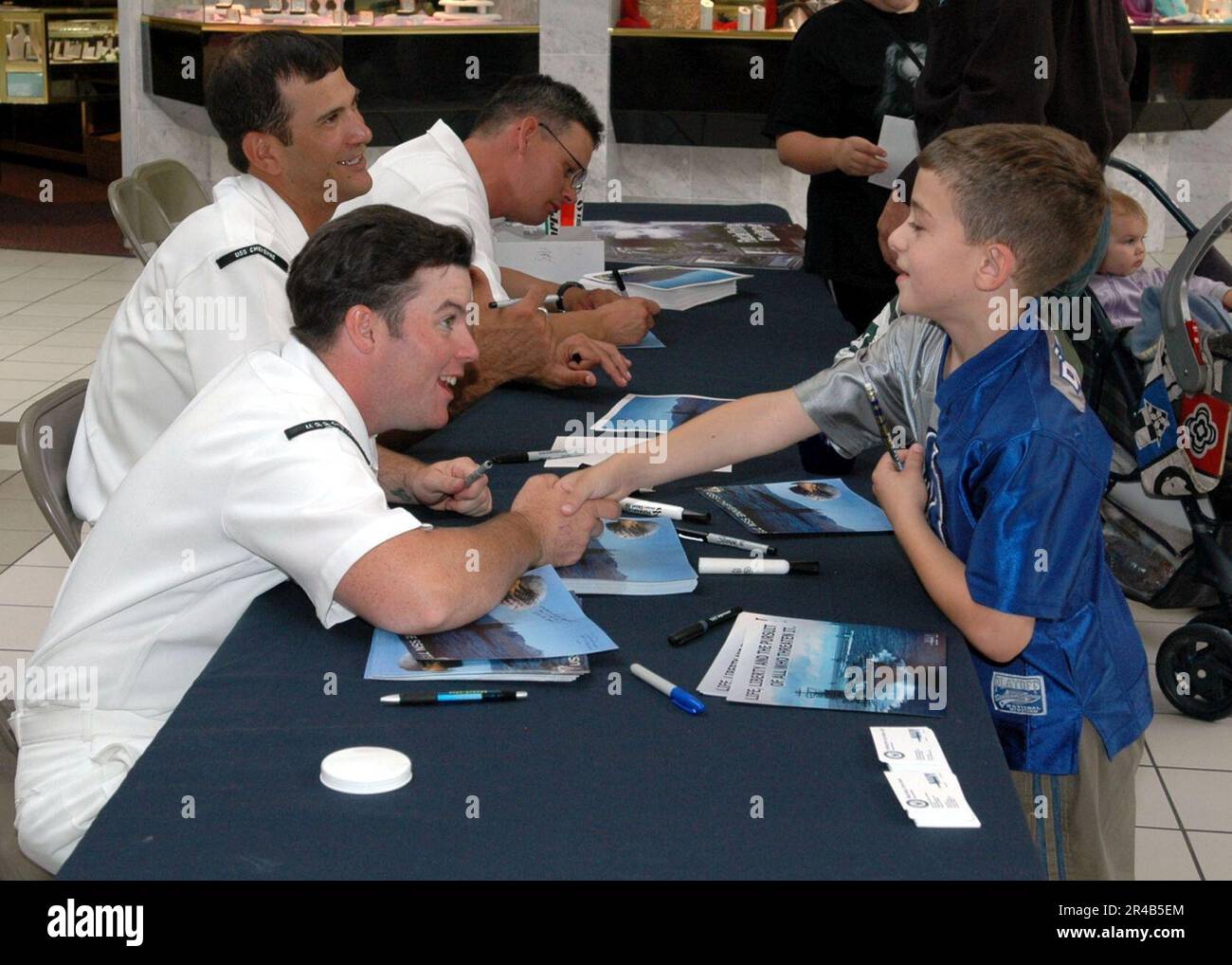 US Navy Submariners assigned to the Los Angeles-class attack submarine ...