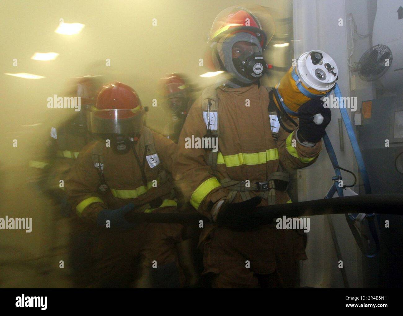 US Navy Fire party Sailors use a Naval Firefighting Thermal Imager ...