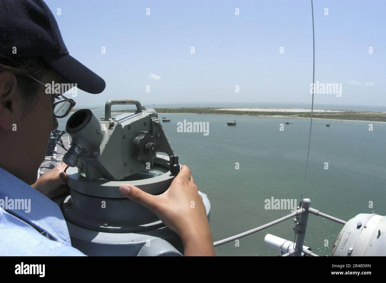 US Navy Quartermaster 3rd Class shoots bearings as the amphibious ...
