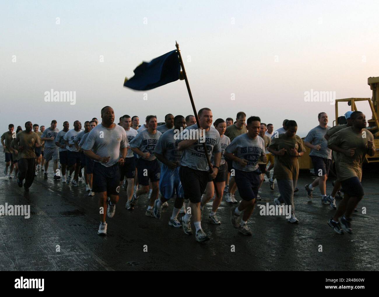 US Navy Chief petty officer (CPO) selectees run in formation with the ...