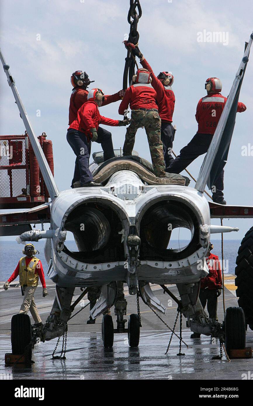 US Navy Crash and Salvage division personnel stabilize a training ...