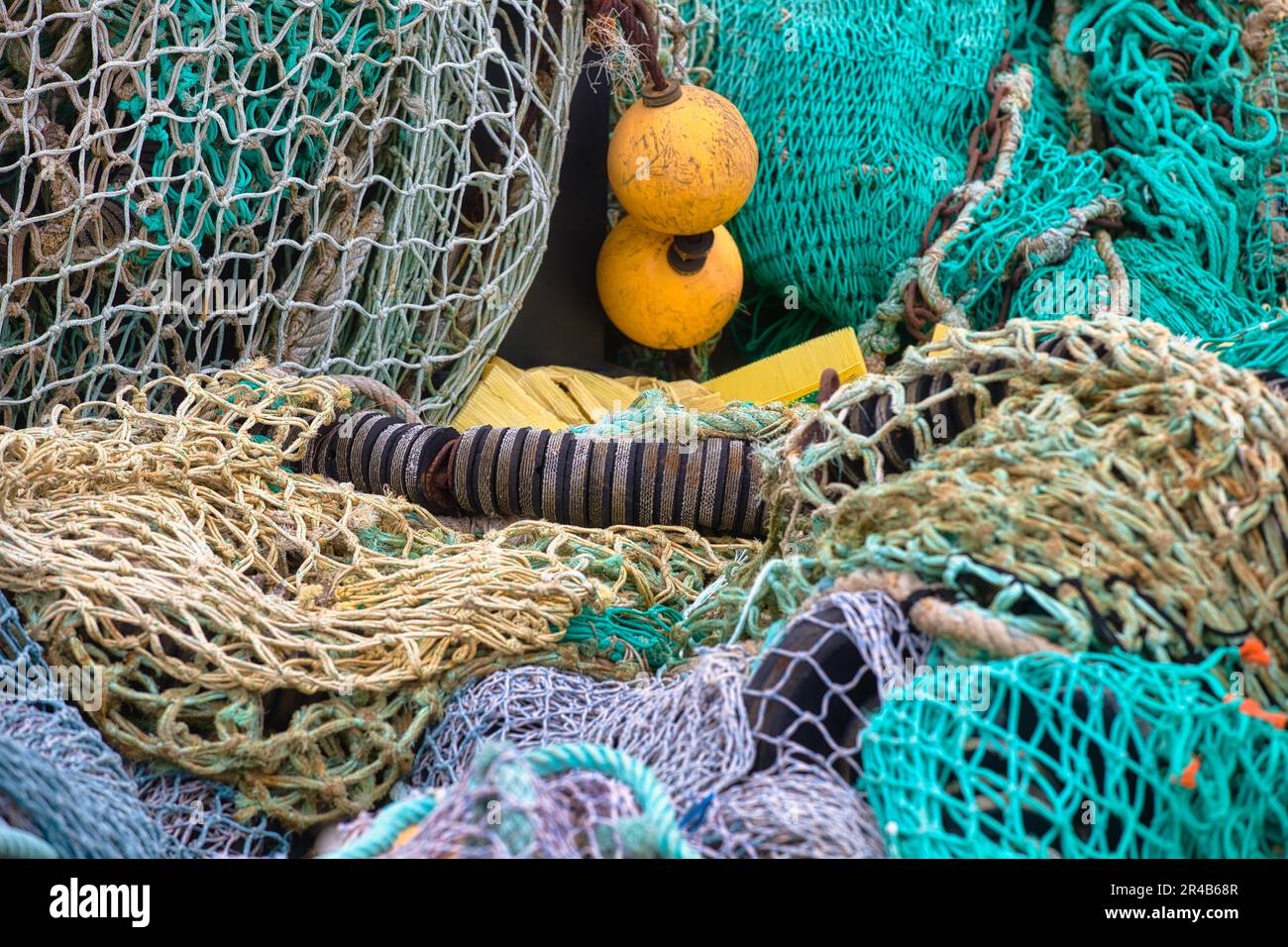 Fishing nets and buoys in the harbour of Guilvinec, Department Finisterre, Brittany, France ...