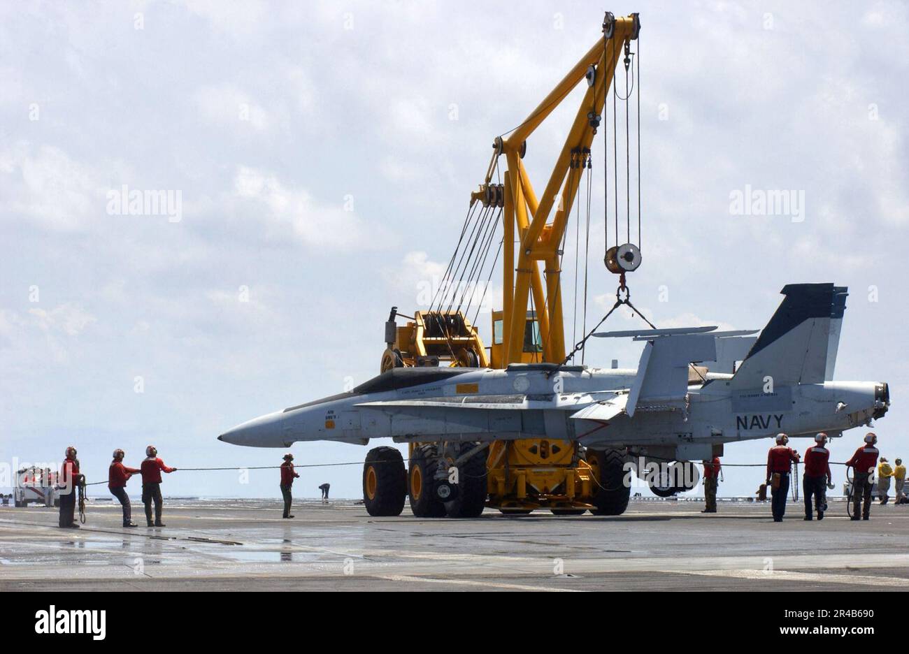 US Navy Crash and Salvage division personnel stabilize a training ...