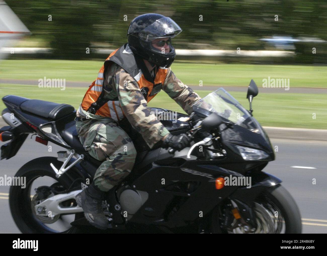 US Navy A Sailor rides his motorcycle on board Naval Station Pearl ...