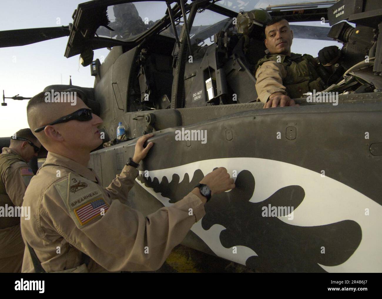 US Navy U.S. Army personnel debrief after landing from a flight in an ...