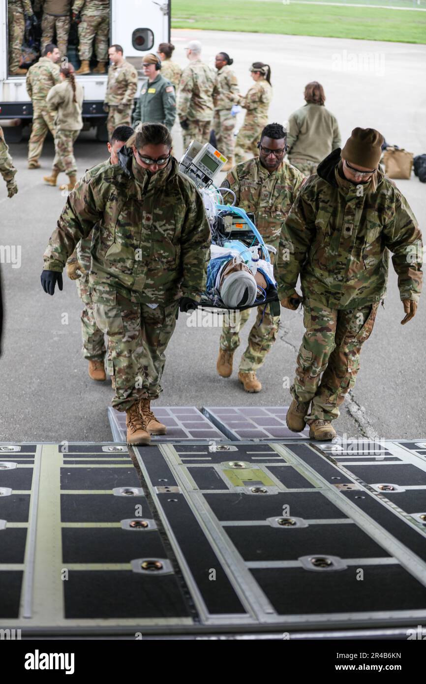 A U.S. Air Force critical care air transport team (CCATT) carries a ...