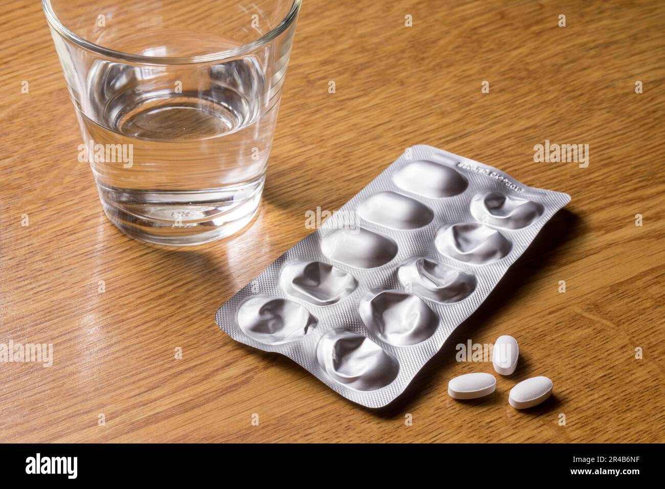 Medicines with a glass of water, tablets, blister pack Stock Photo - Alamy
