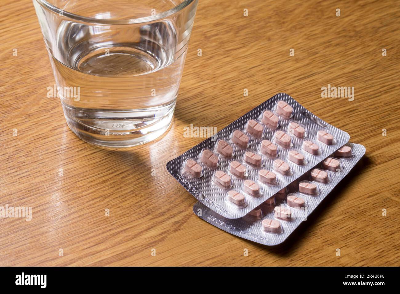 Medicines with a glass of water, tablets, antihypertensives, blister ...