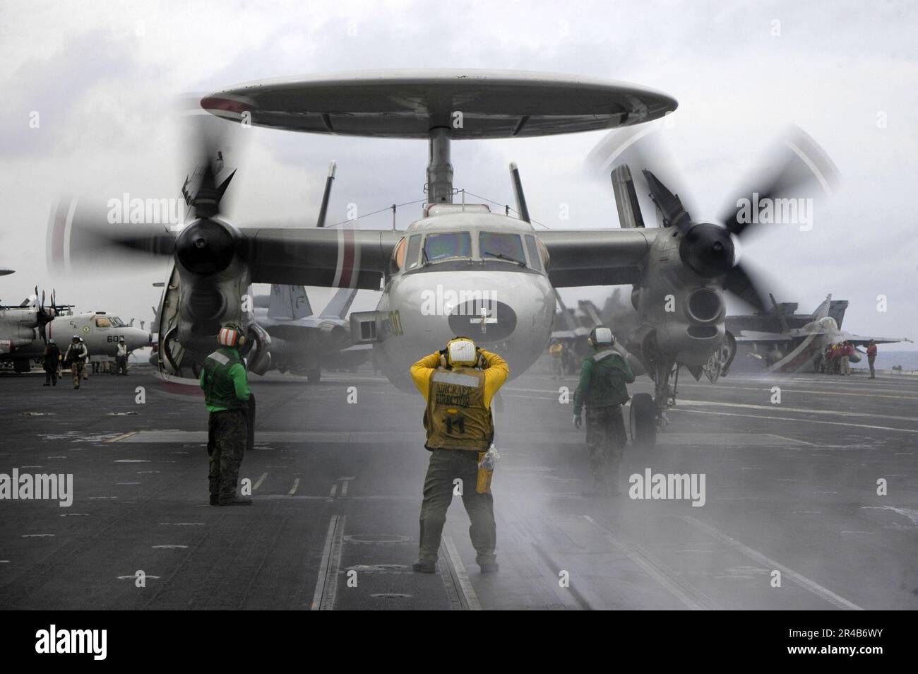 US Navy An aircraft director aboard the conventionally powered aircraft ...