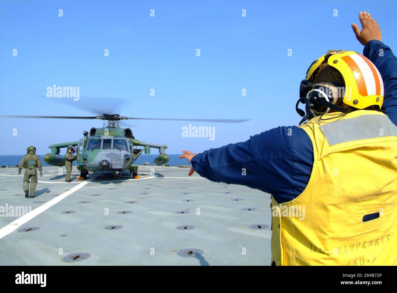 US Navy A Blackhawk helicopter from the Royal Brunei Air Force sits on ...