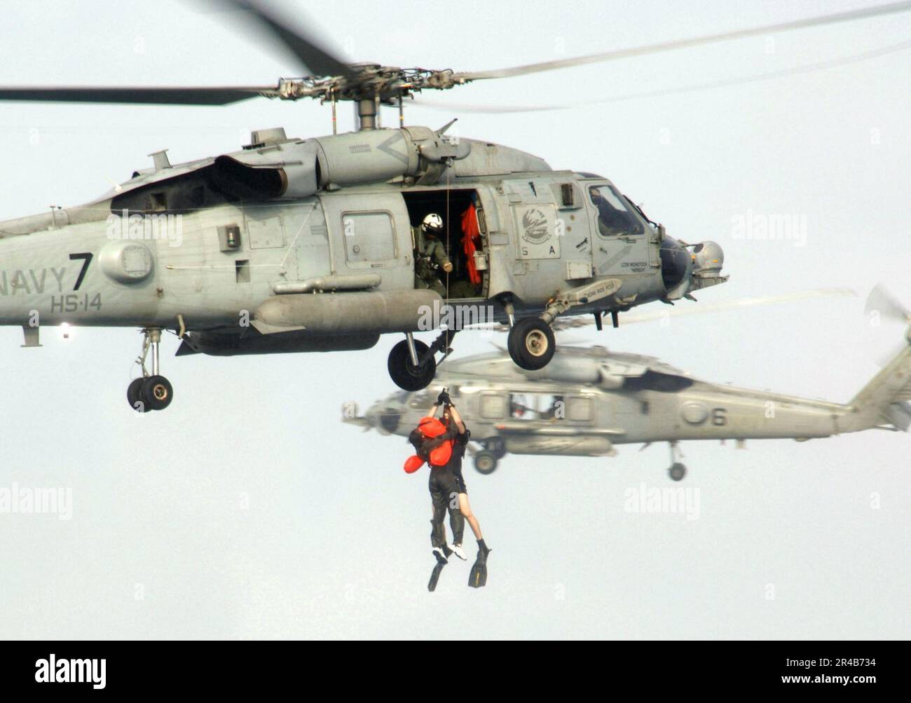 US Navy U.S. Air Force Tech. Sgt. is hoisted aboard a U.S. Navy HH-60H ...