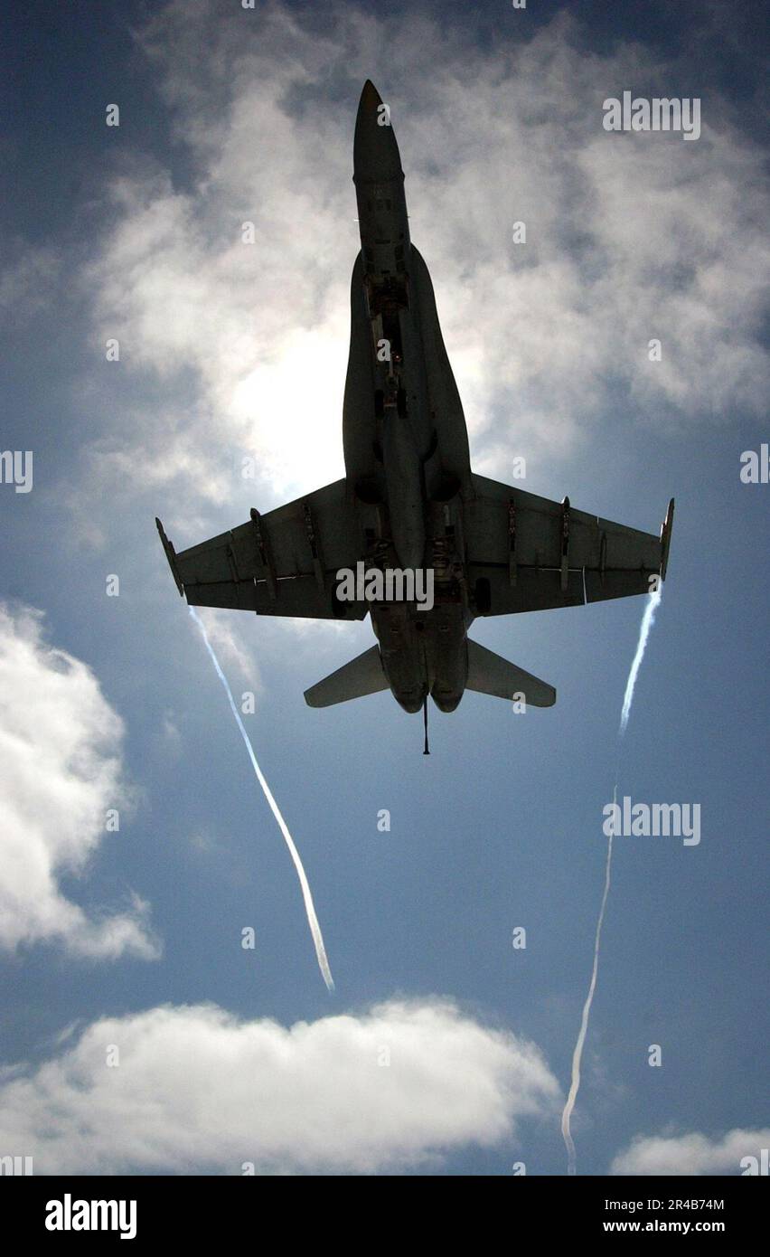 US Navy A F-A-18 Hornet makes its approach for an arrested landing ...