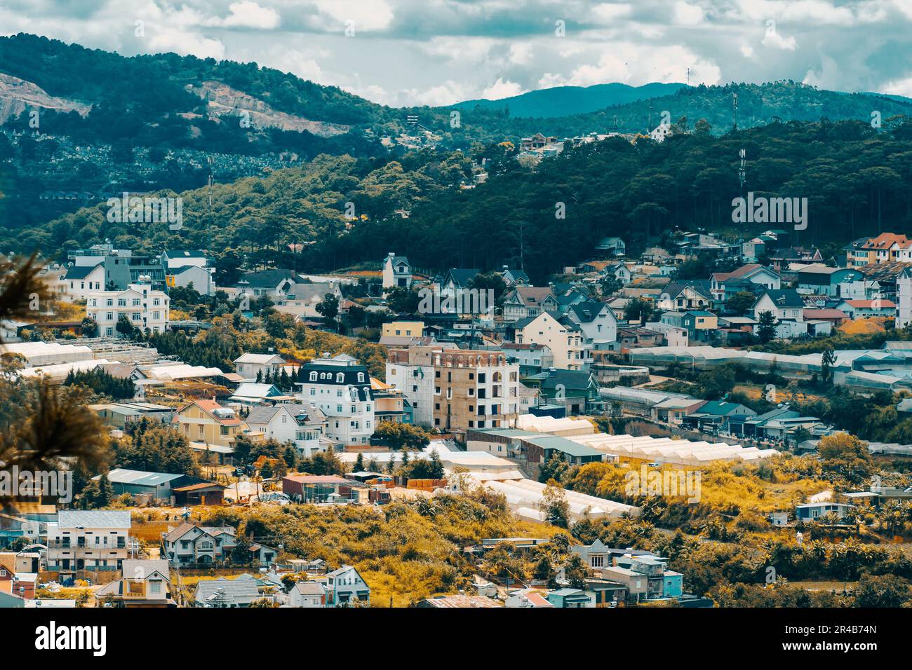 An aerial view of a city with residential buildings situated on sloping ...
