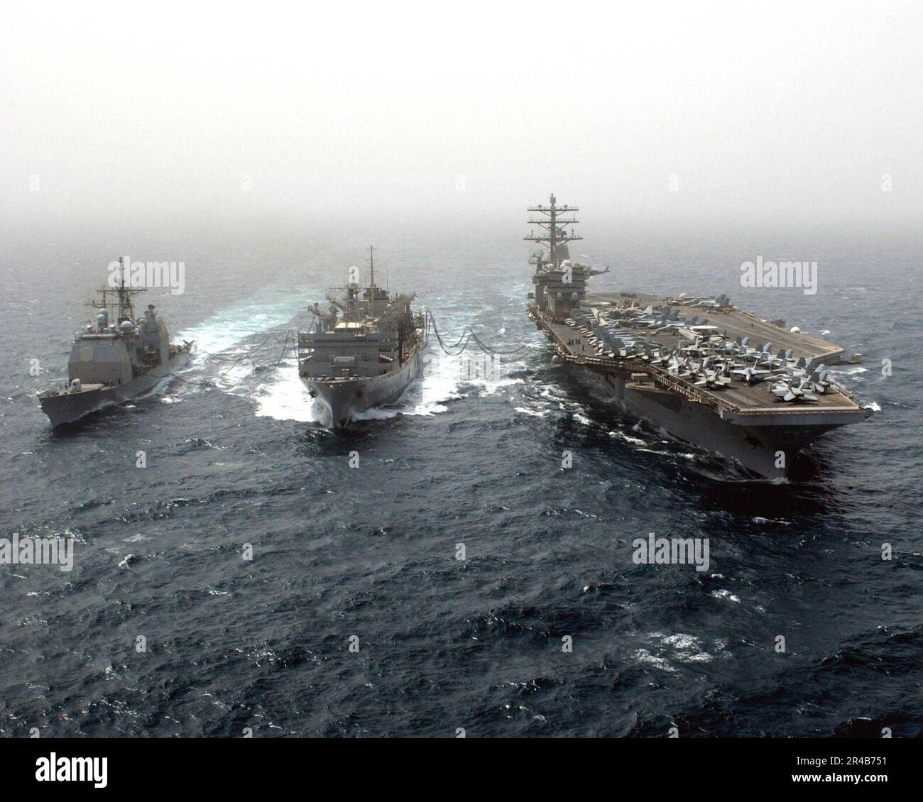 US Navy From left, The guided missile cruiser USS Princeton (CG 59), the Military Sealift ...