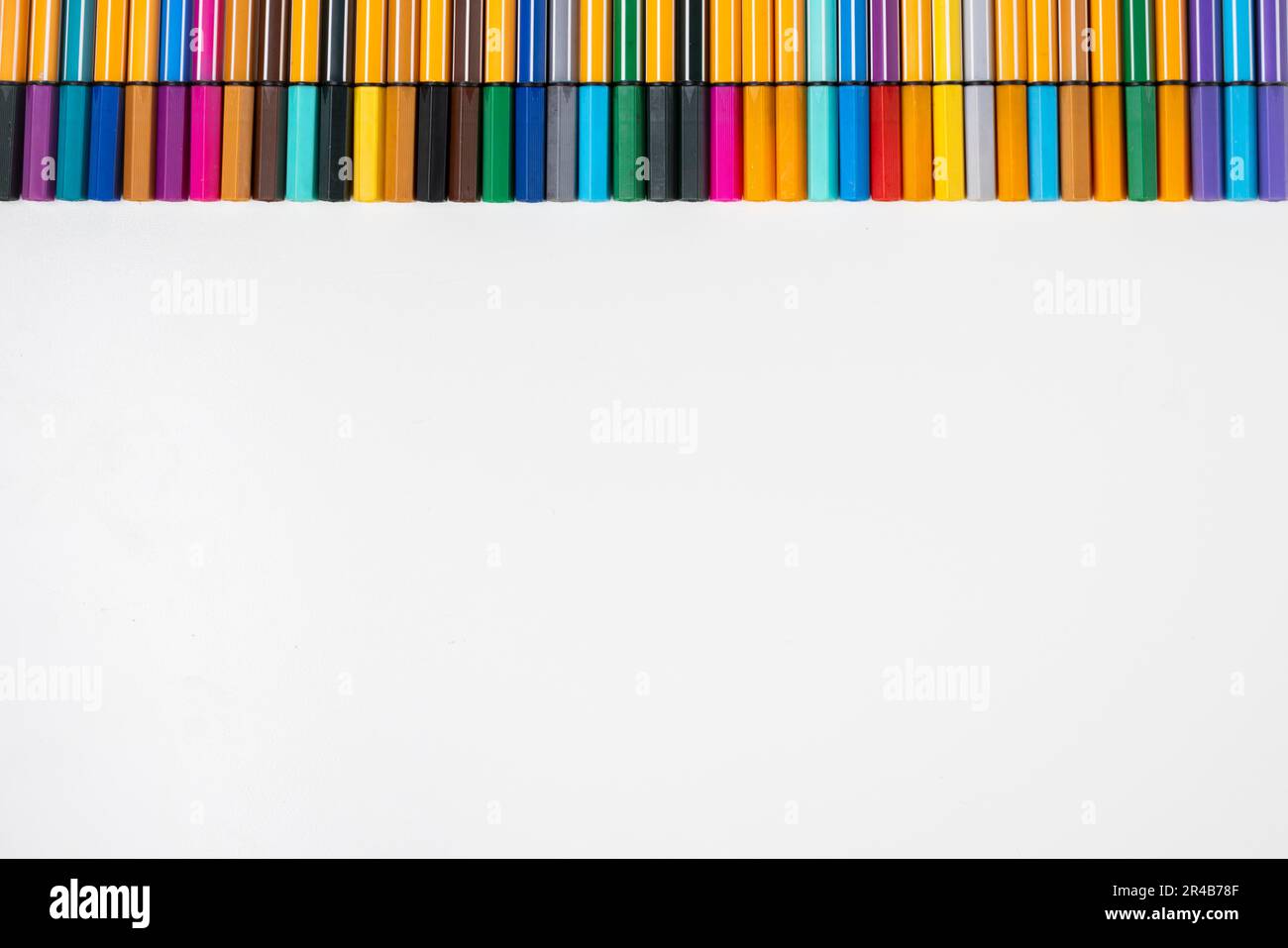 Different coloured fineliners above, white background, copy space below ...