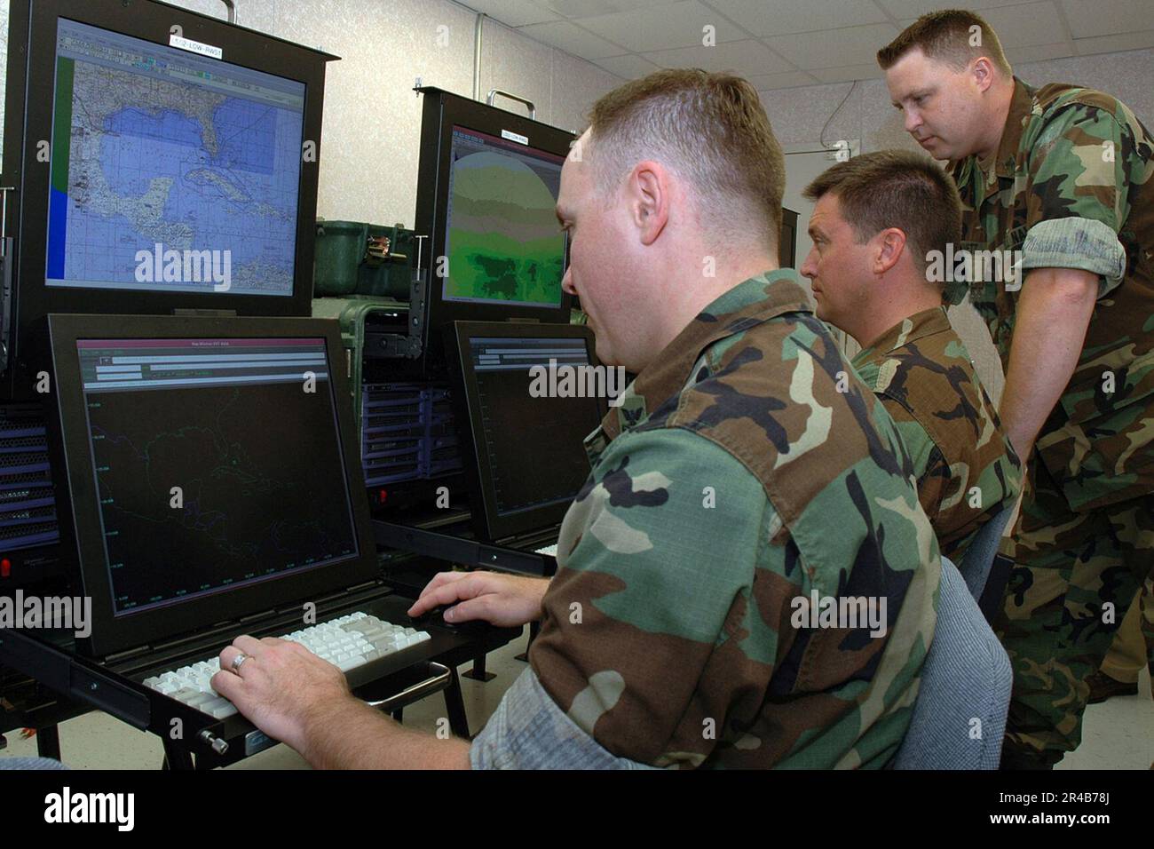 US Navy A team of intelligence Specialist analyze maritime traffic ...