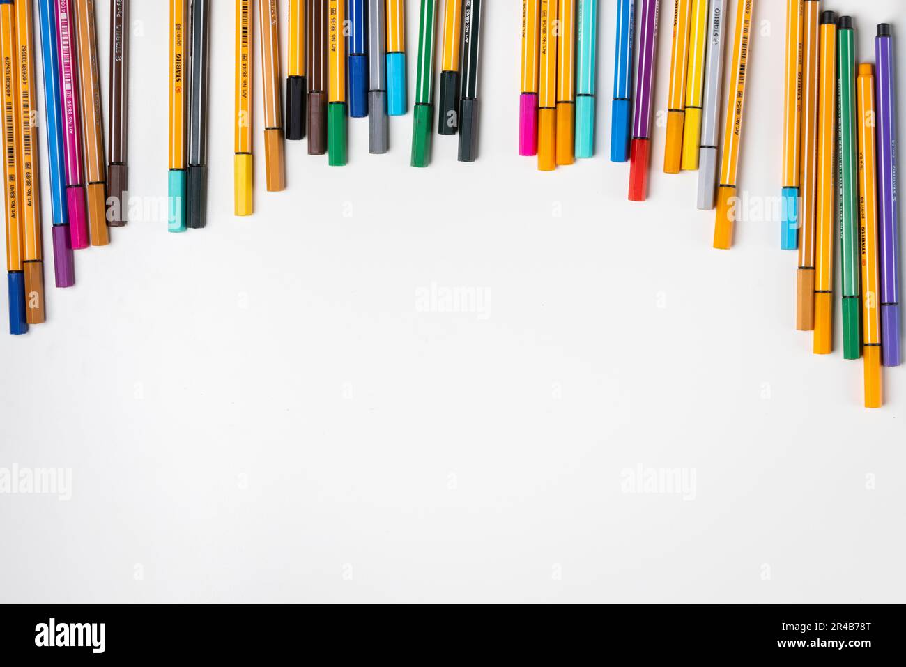 Different coloured fineliners above, white background, copy space below ...